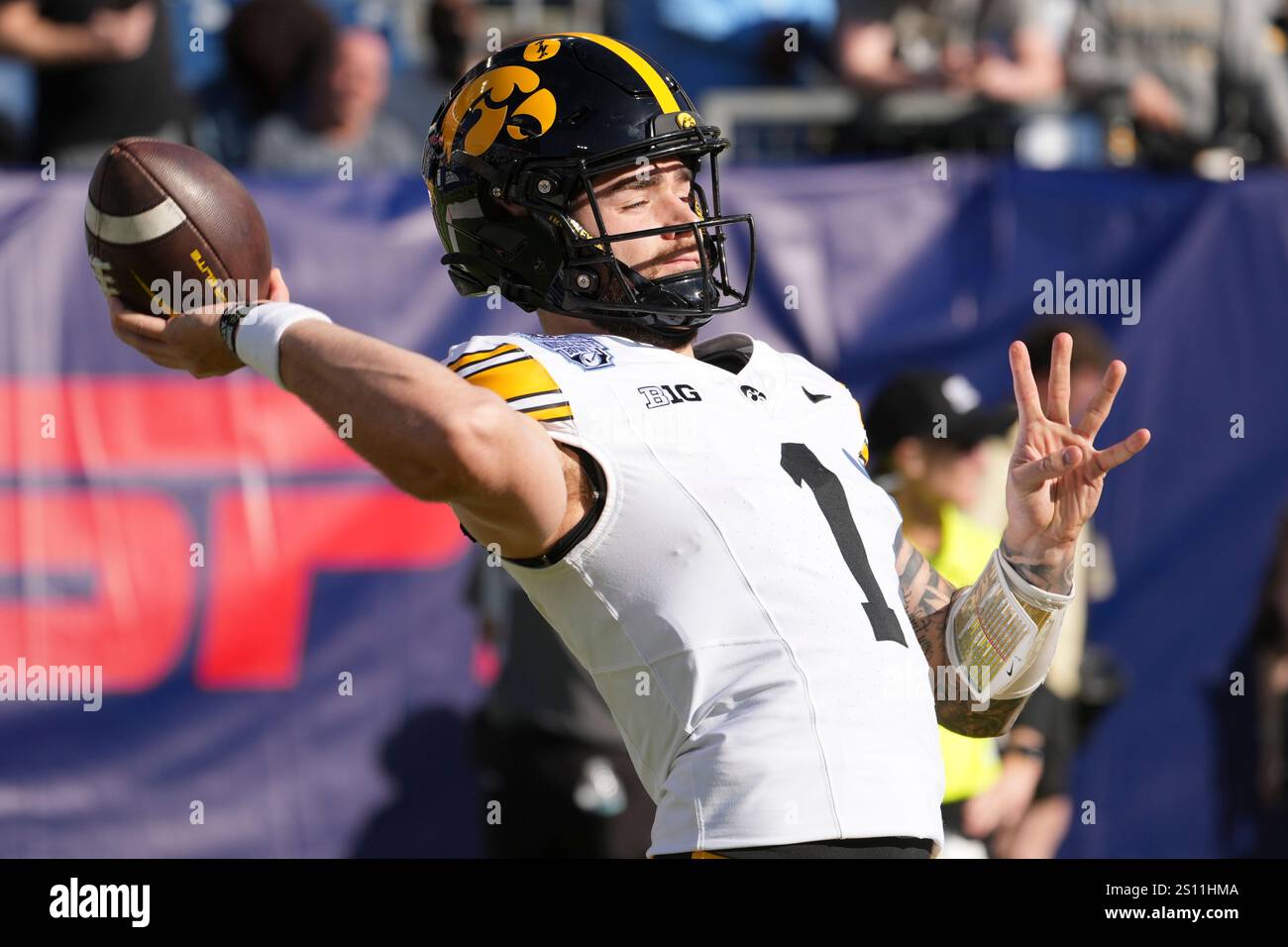 Iowa quarterback Brendan Sullivan (1) warms up before the Music City ...