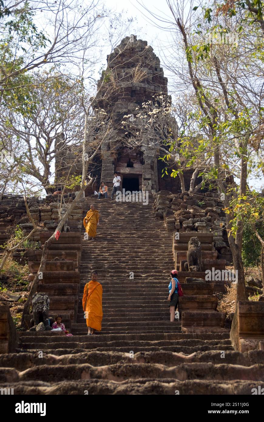 Monks descend the 358 stairs that lead to Wat Banan on top of Phnom ...
