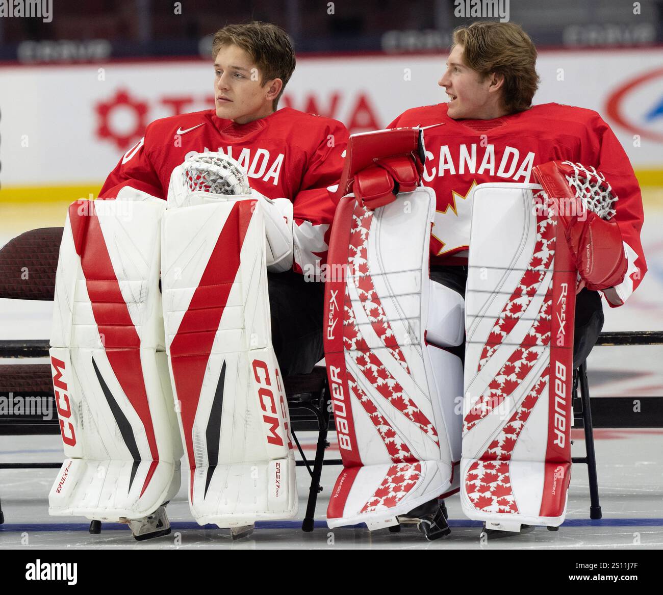 Canada goaltender Carter George, left, and goaltender Jack Ivankovic ...