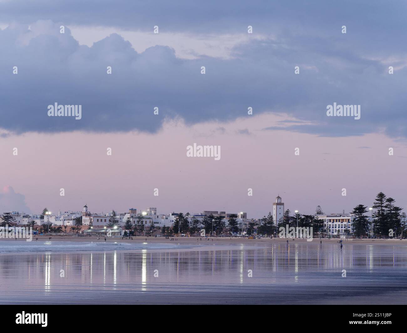 Historic Medina and beach at blue hour with clouds above in the town of ...