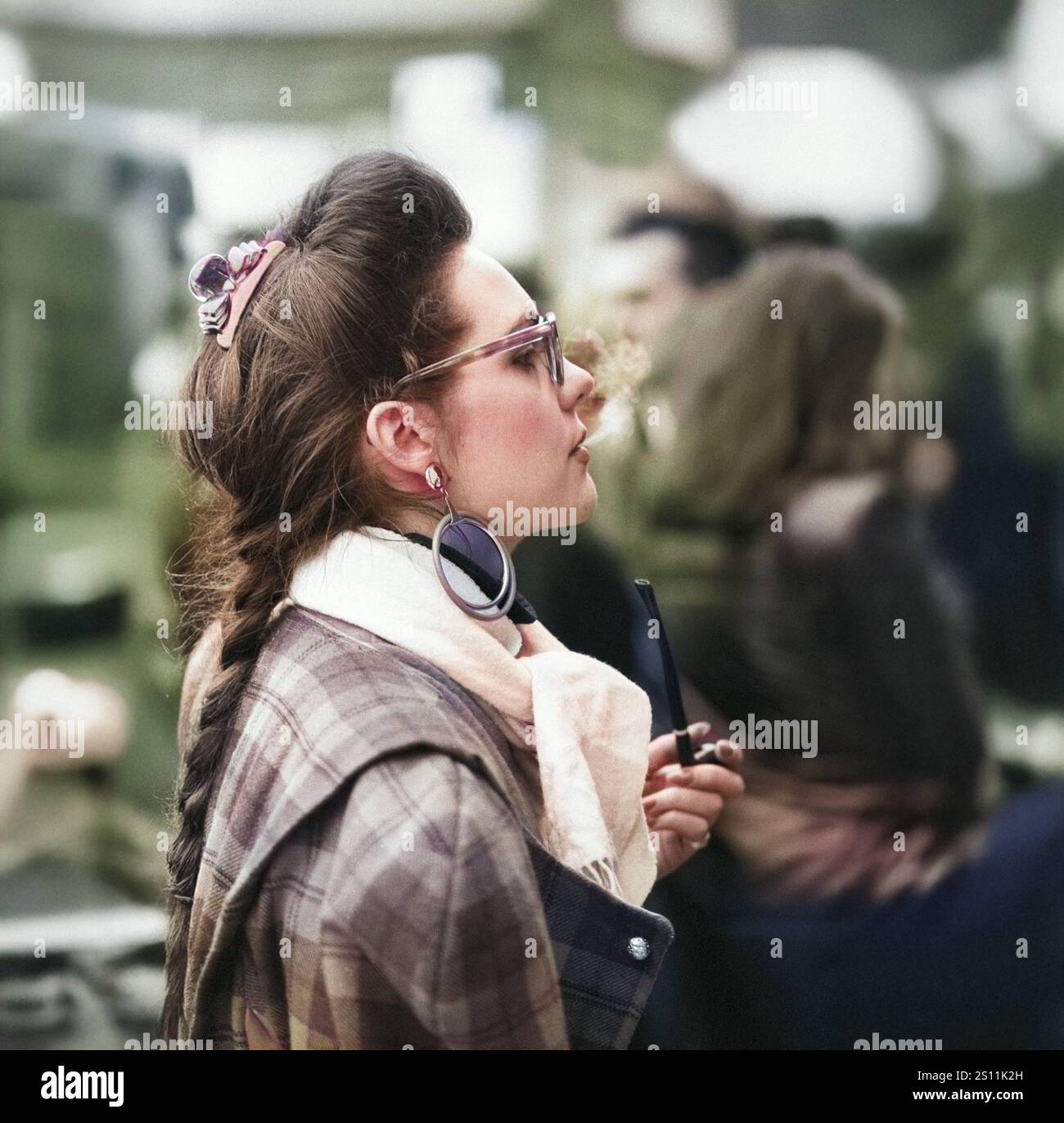 Lady smoking pipe in Paris during fashion week 1989 Stock Photo - Alamy