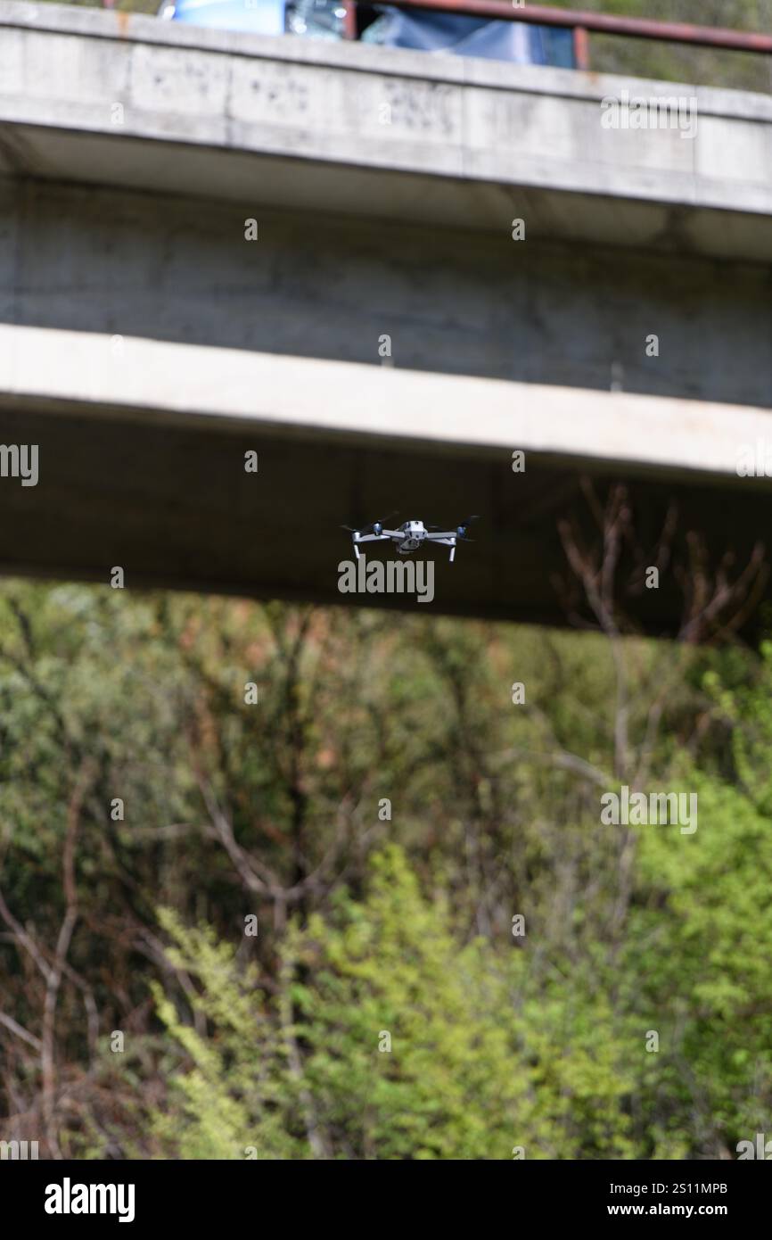 Small High-Performance Drone Operating Near Forested Terrain And Bridge ...