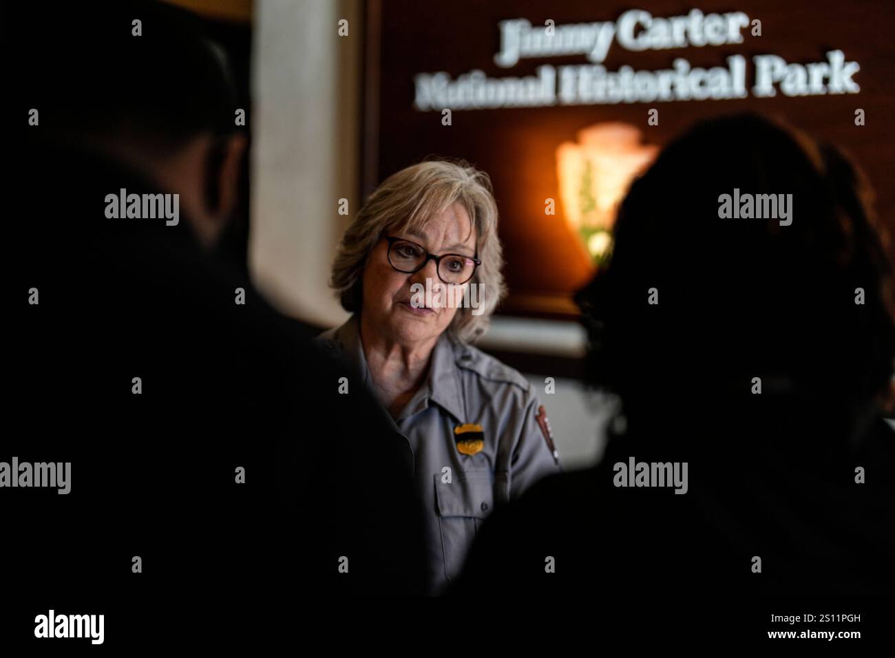 National Park employee Mary Anne Robbins speaks to guests of the Jimmy ...