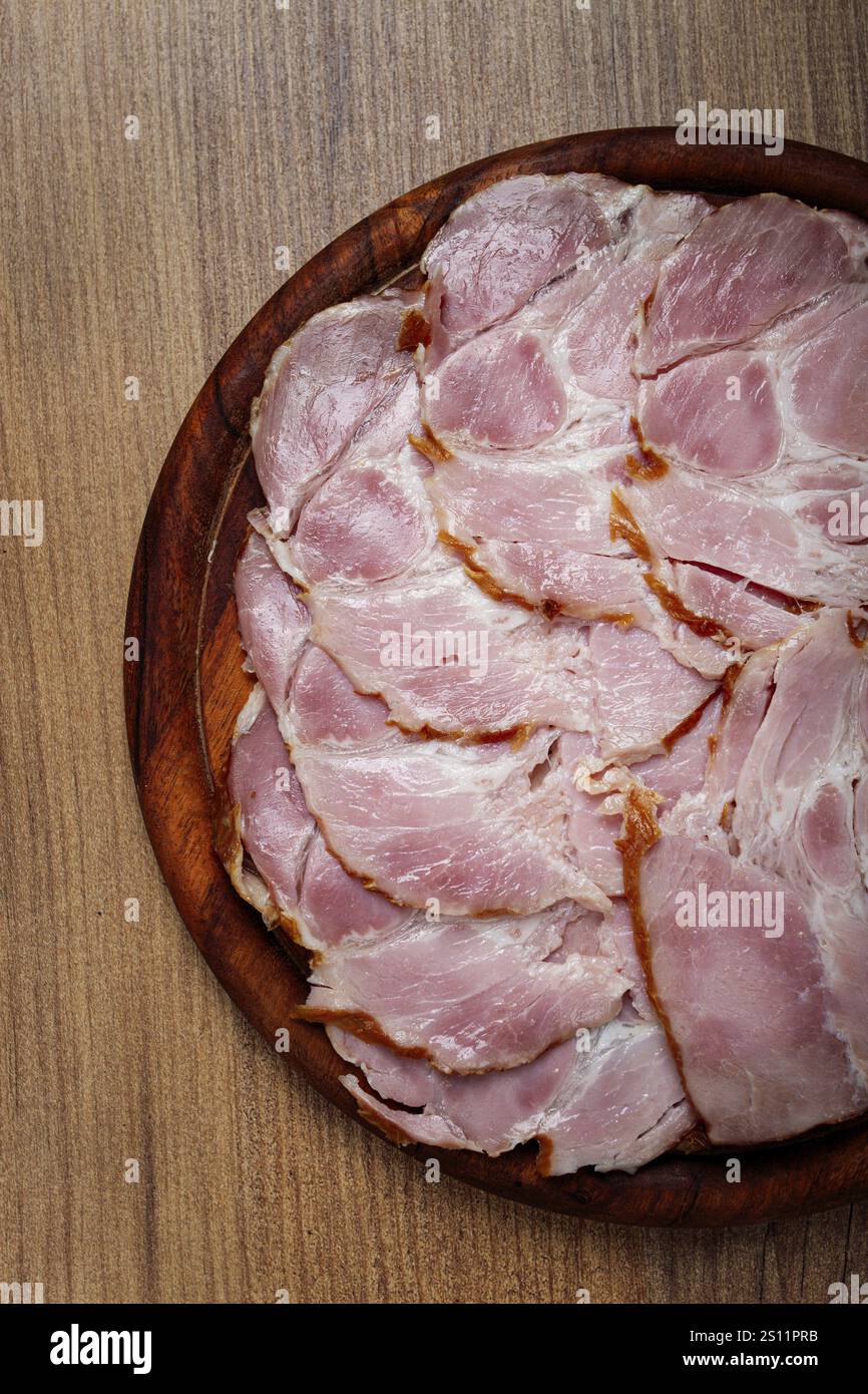 Sliced pork neck, boiled and smoked, smoked pork neck, sliced, on a ...