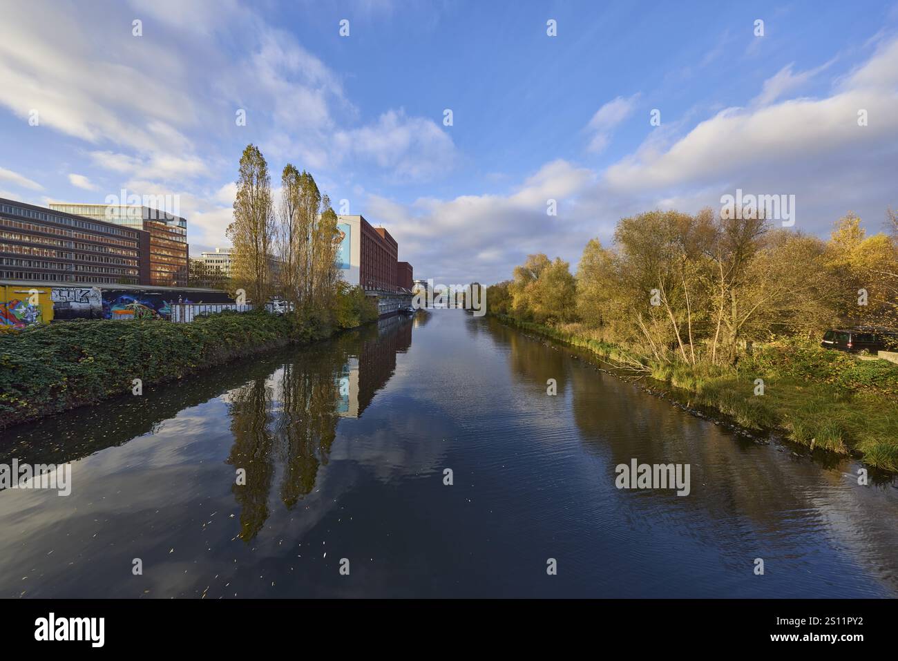 General architecture, trees, canal to the flood basin, blue sky with ...