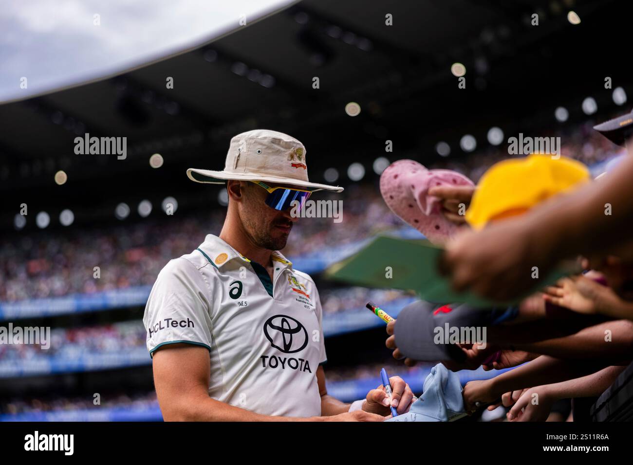 MELBOURNE, AUSTRALIA - DECEMBER 30: Mitchell Starc of Australia signing ...