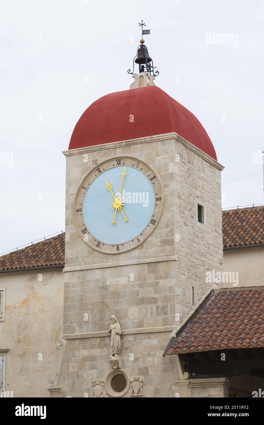 Close-up of old15th century San Sebastian church clock tower with gold ...