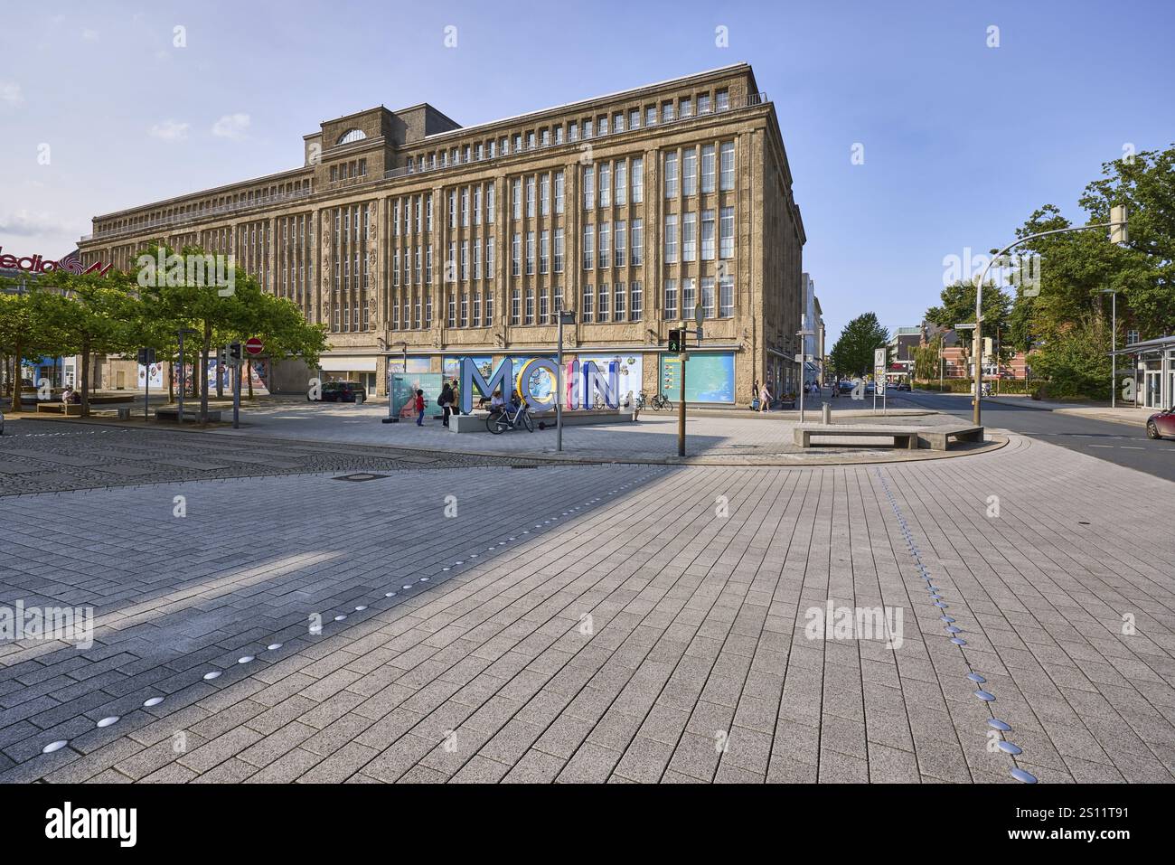 MOIN letters, historic sandstone building with tall slender windows ...