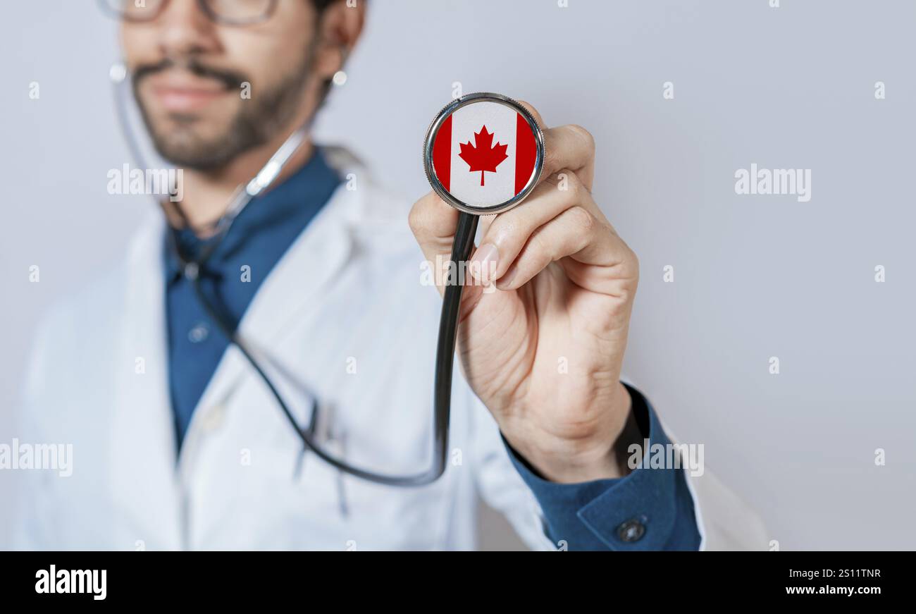 Doctor holding stethoscope with Canada flag. Canadian Health and Care ...