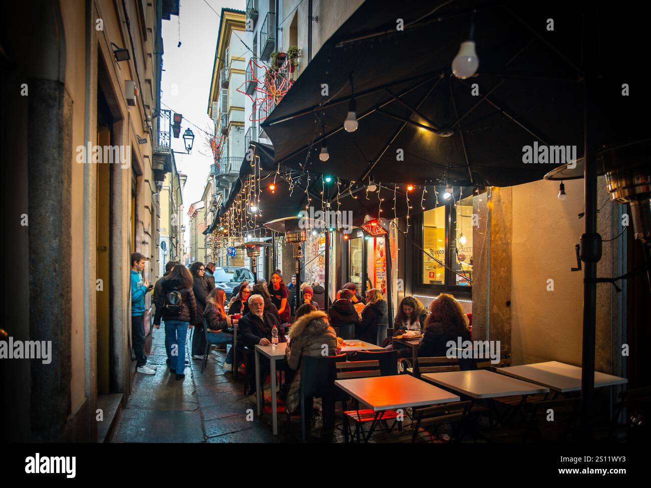 Italy Piedmont Turin Christmas people sitting in the outdoor areas of ...