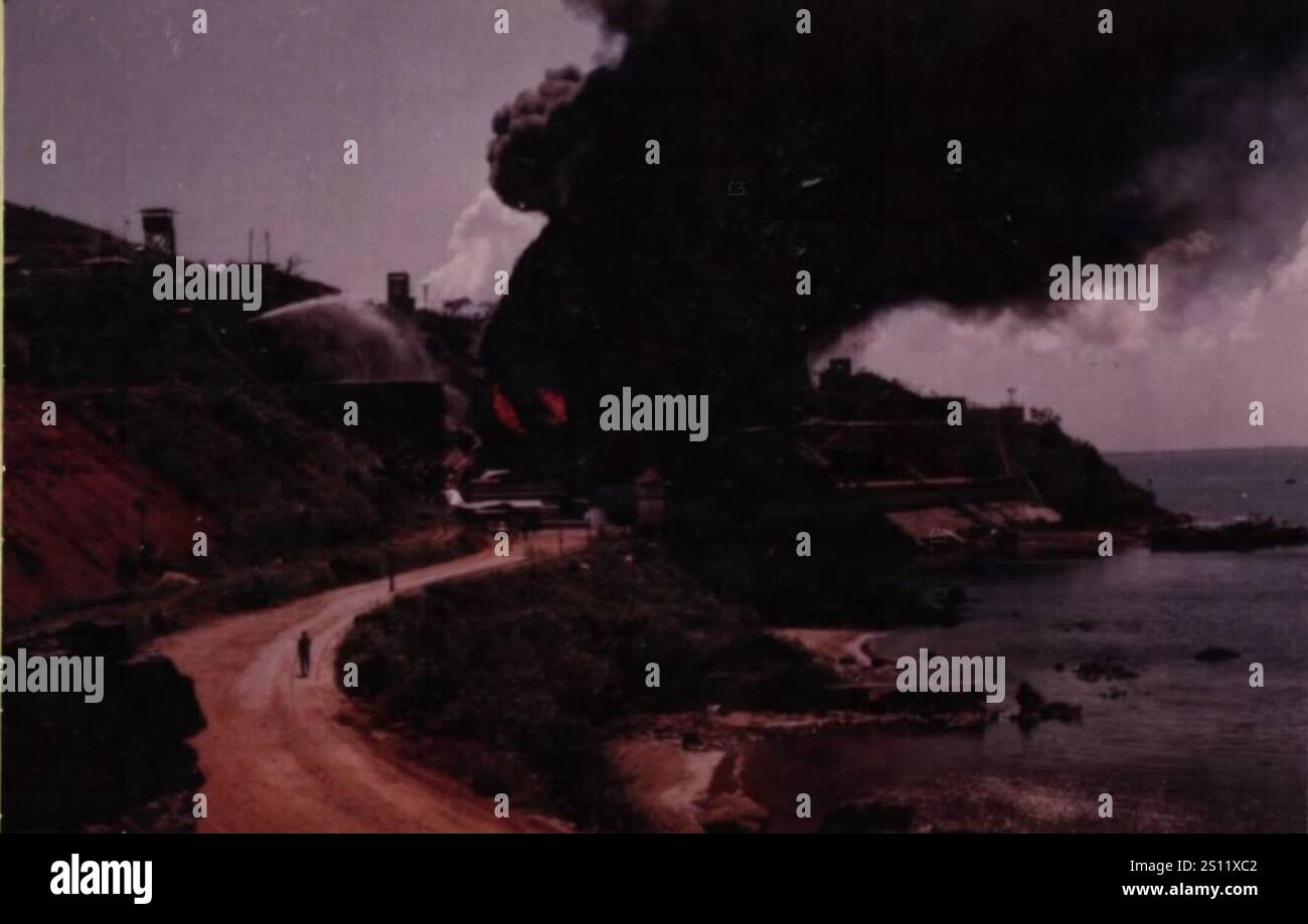 Esso fuel plant at base of Hai Van Pass on fire after VC attack Stock ...