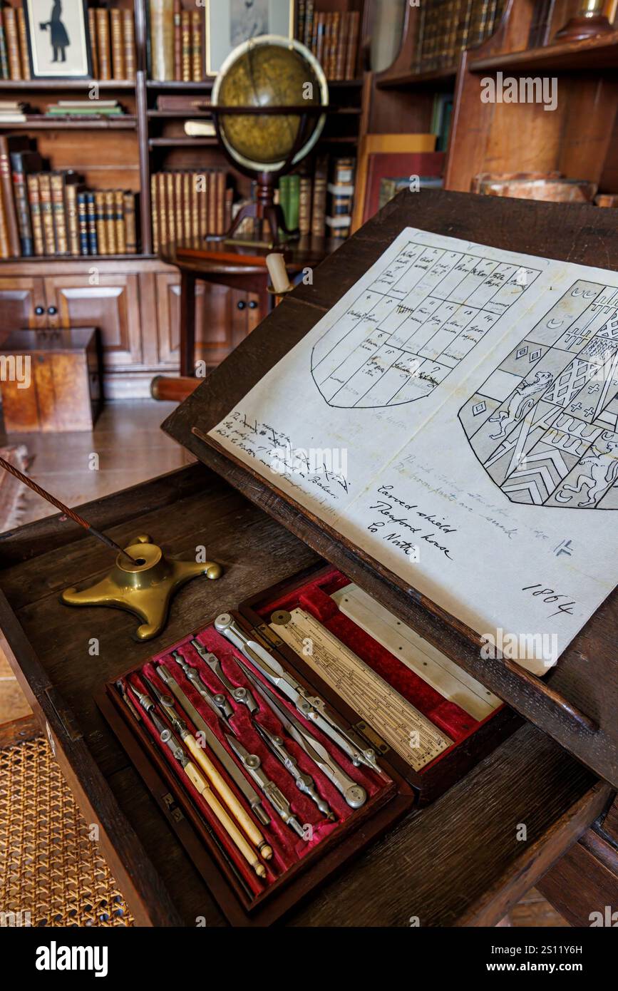 Coat of arms drawing and writing pens in the library, Canons Ashby ...
