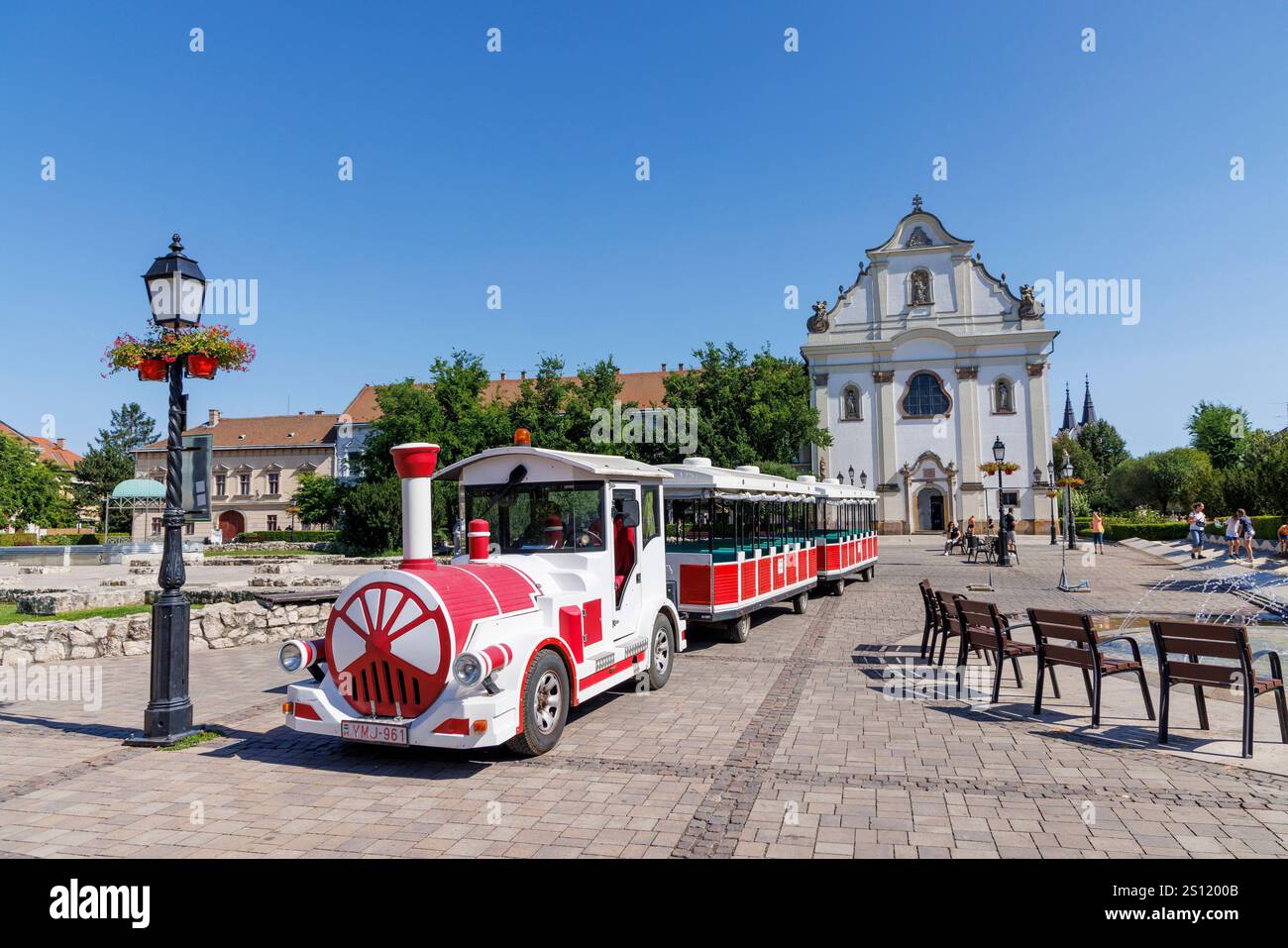 Tourist train in front of the Dominican church of Our Lady of Victory ...
