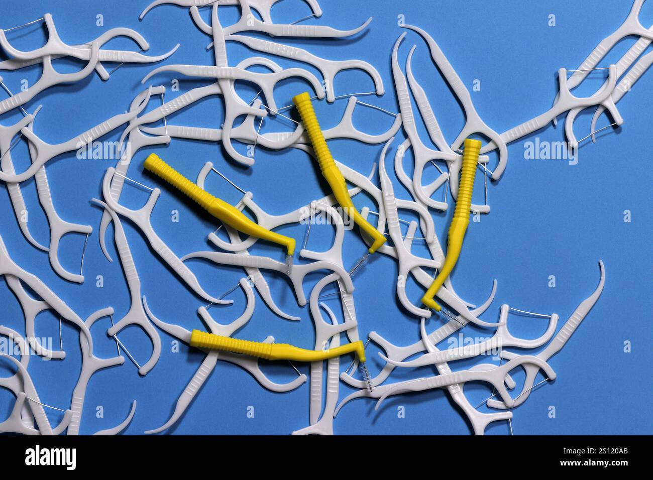 Image of white and yellow interdental brushes and toothpicks with ...