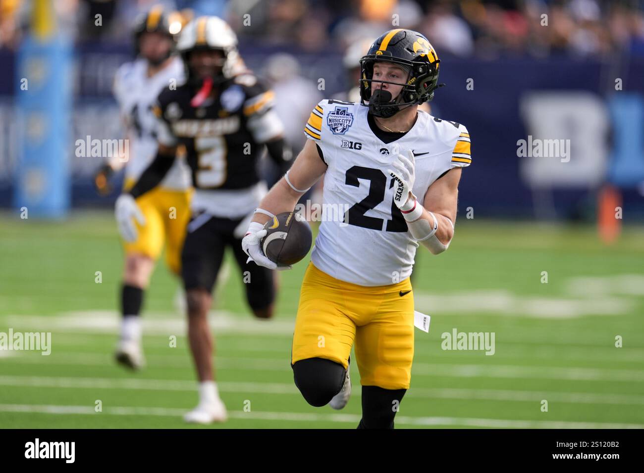 Iowa wide receiver Kaden Wetjen (21) runs for a touchdown as he returns ...