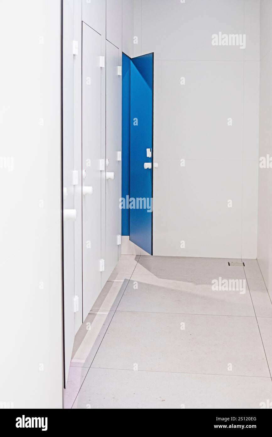 blue doors to the toilet room in a light interior in a supermarket ...