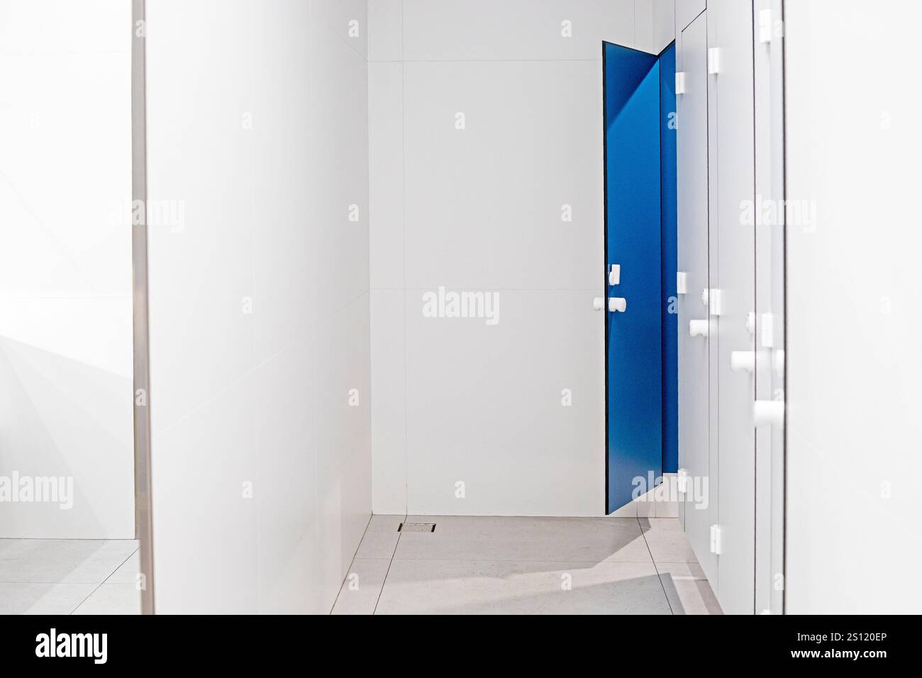 blue doors to the toilet room in a light interior in a supermarket ...
