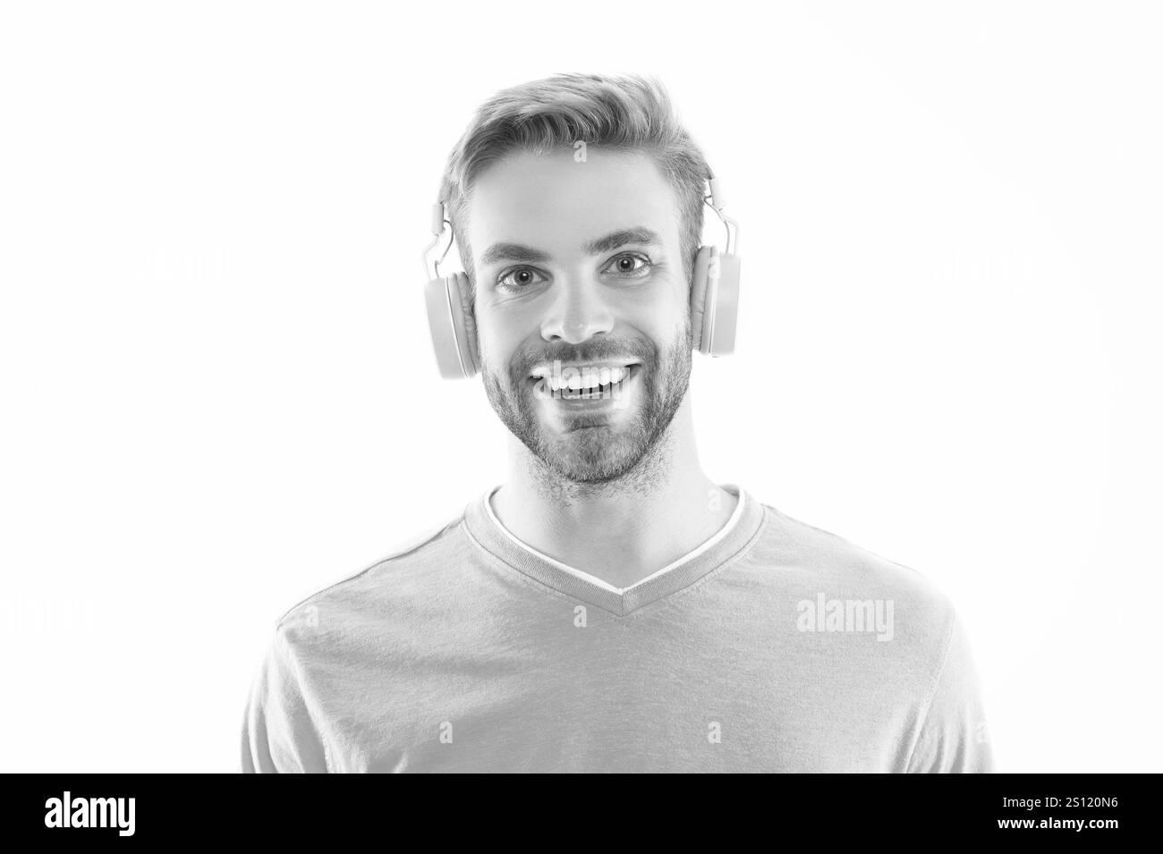 Portrait of happy guy listening to music. Guy with smiling face wearing ...