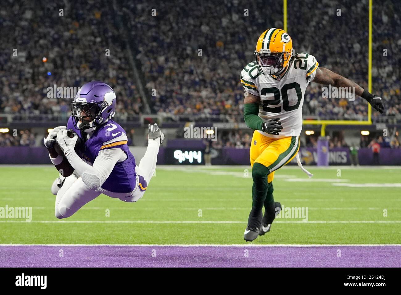 Minnesota Vikings' Jordan Addison catches a touchdown pass in front of ...