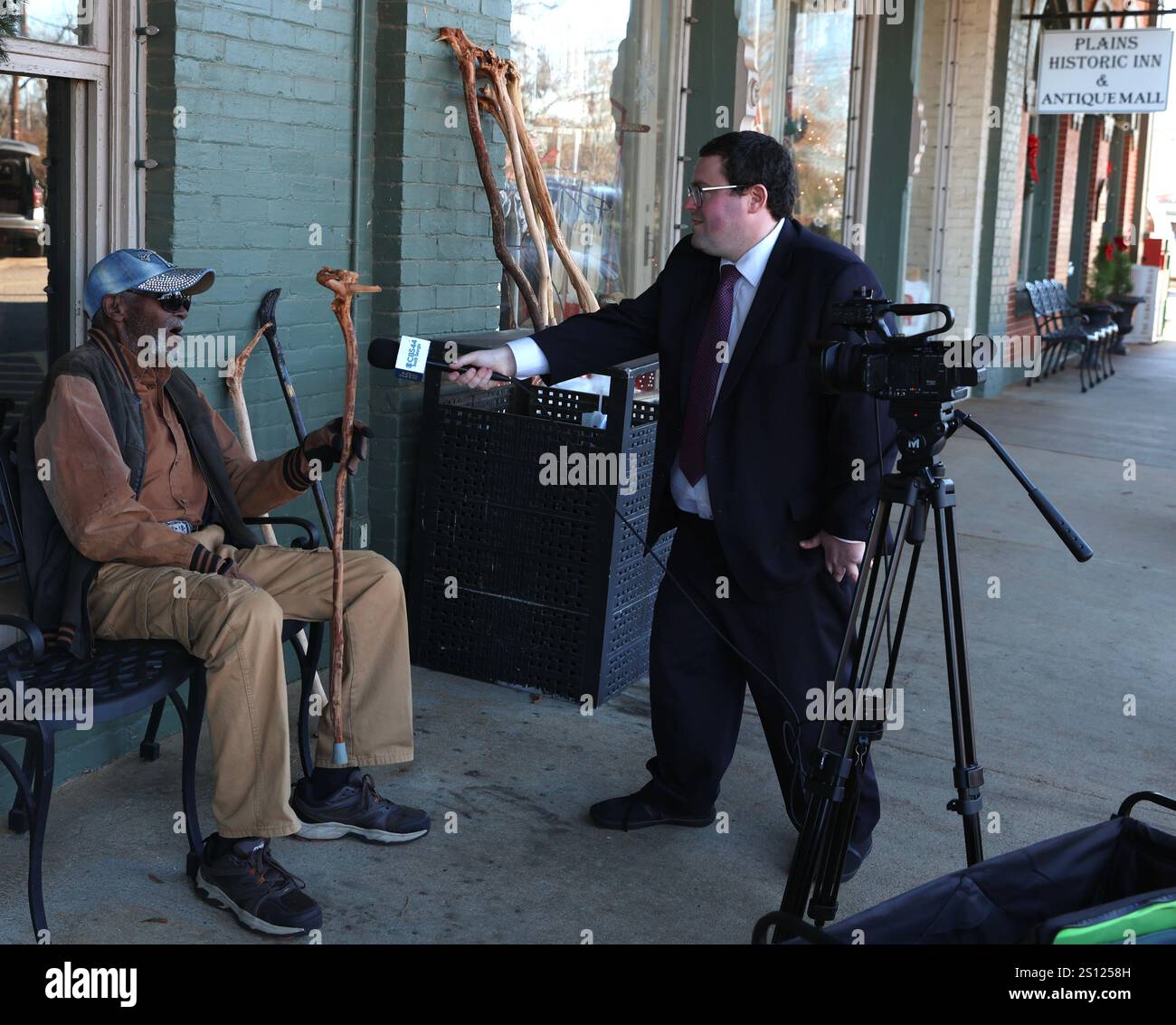 Plains, Georgia, USA. 30th Dec, 2024. CBS44 local reporter Brian Roche ...