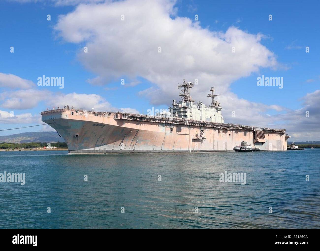 Ex USS Tarawa (LHA-1), is escorted out of Pearl Harbor during RIMPAC ...