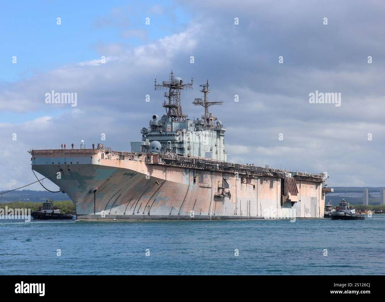 Ex USS Tarawa (LHA-1), is escorted out of Pearl Harbor during RIMPAC ...