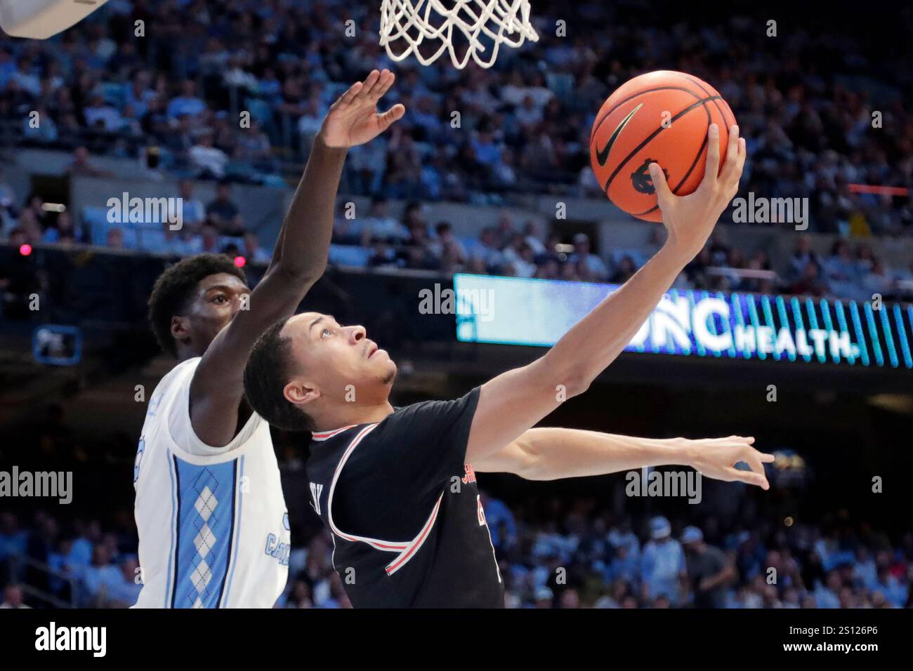 Campbell guard Cam Gregory, right, drives against North Carolina guard ...