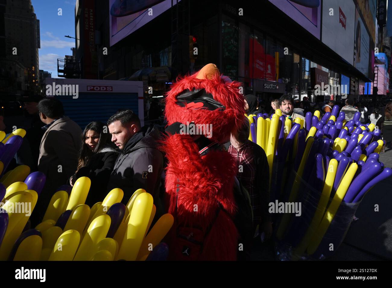New York, USA. 30th Dec, 2024. A busker in an Elmo costume seen between ...