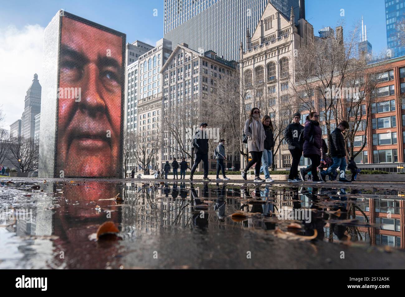 Chicago, USA. 30 December 2024. Tourists pass artist Jaume Plenska’s ...