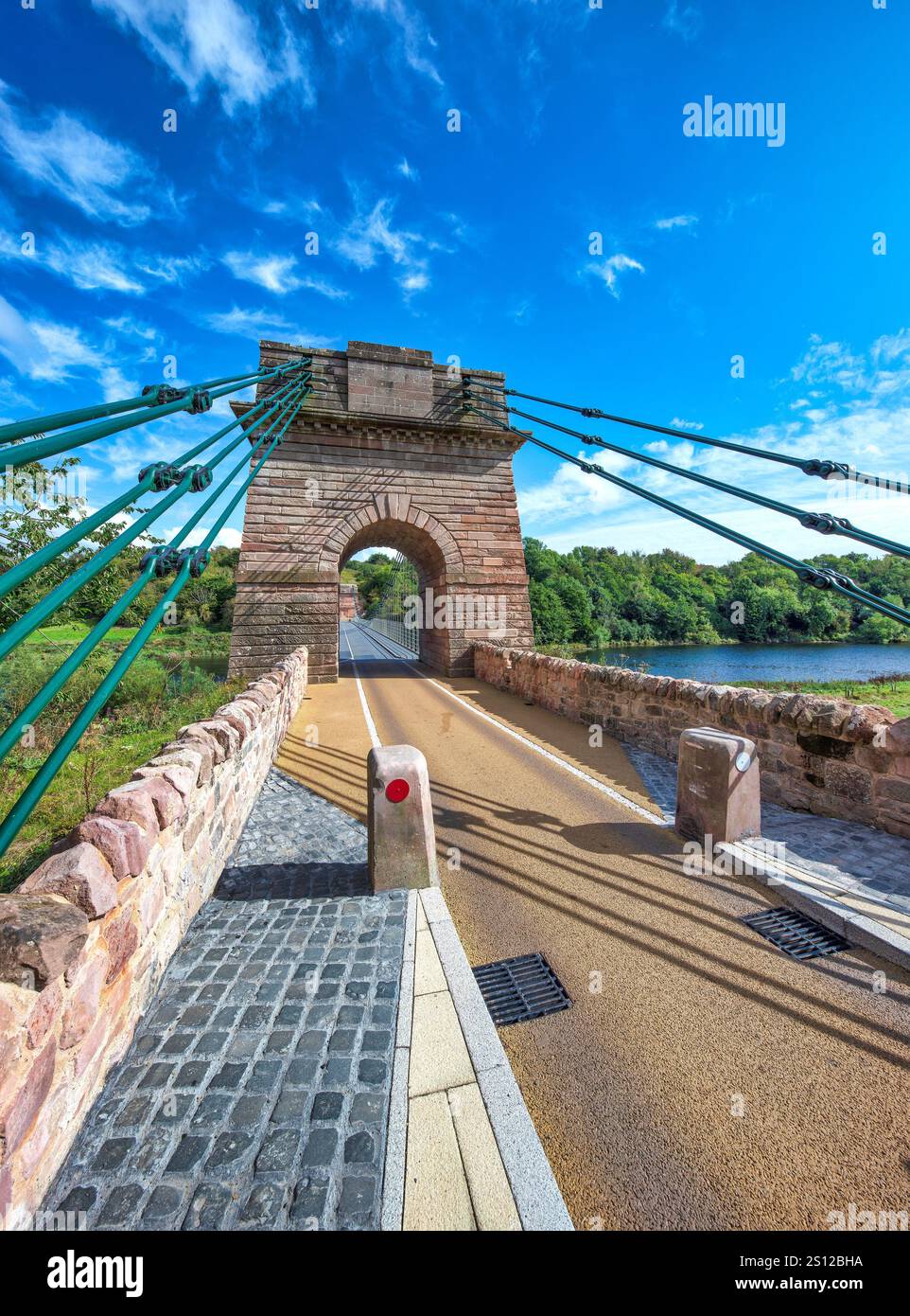 Daytime view in summer of the Chain Suspension Bridge over the River ...