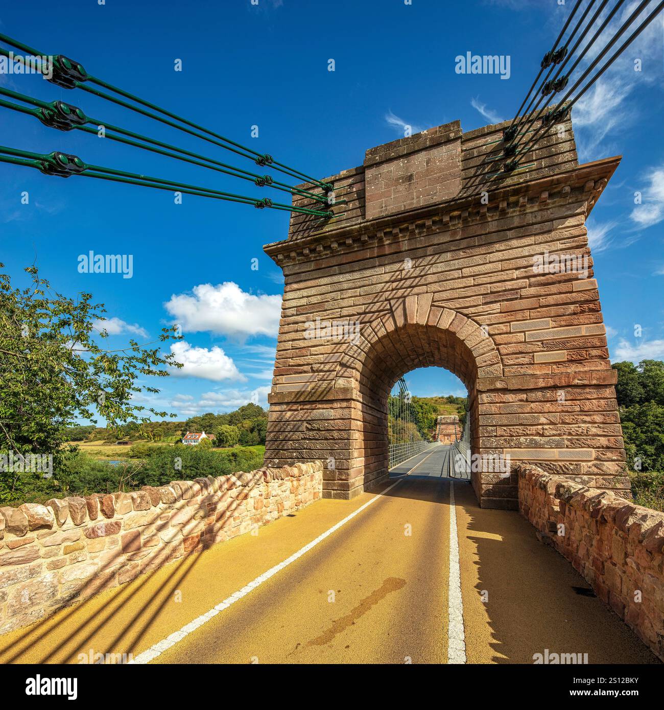 Daytime view in summer of the Chain Suspension Bridge over the River ...