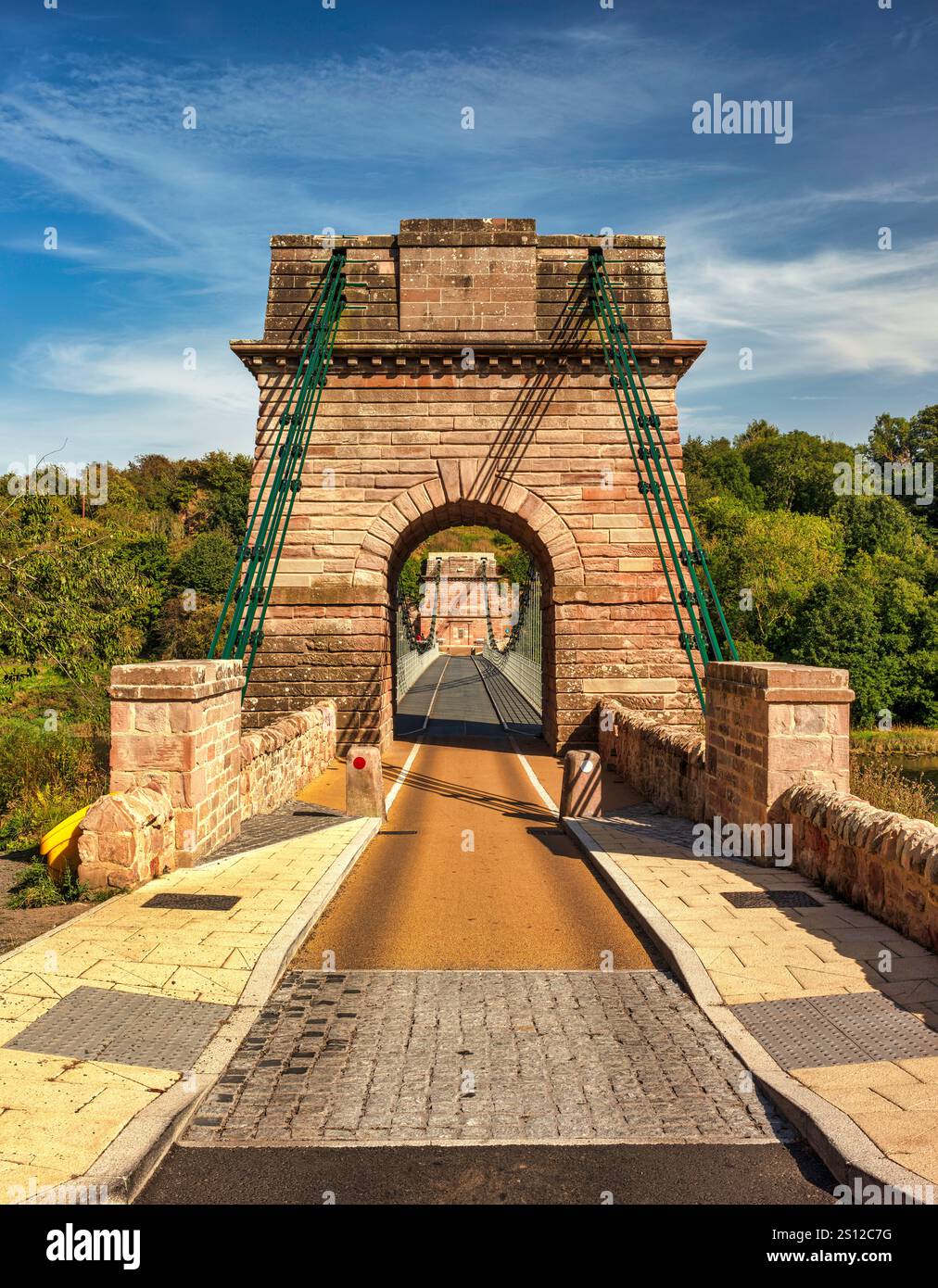 Daytime view in summer of the Chain Suspension Bridge over the River ...