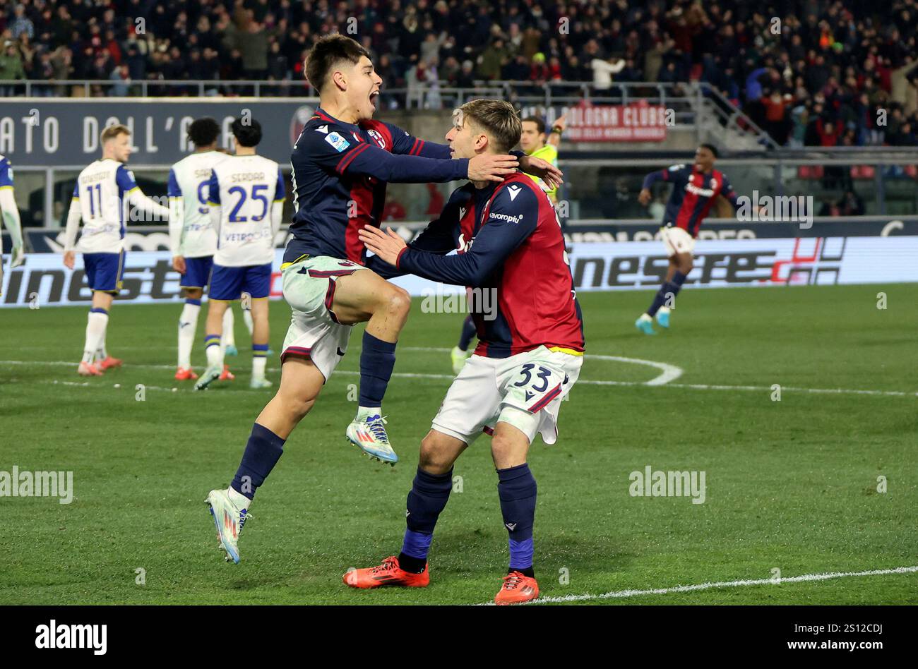 Bologna's Benjamin Dominguez, left, celebrates scoring during the Serie ...
