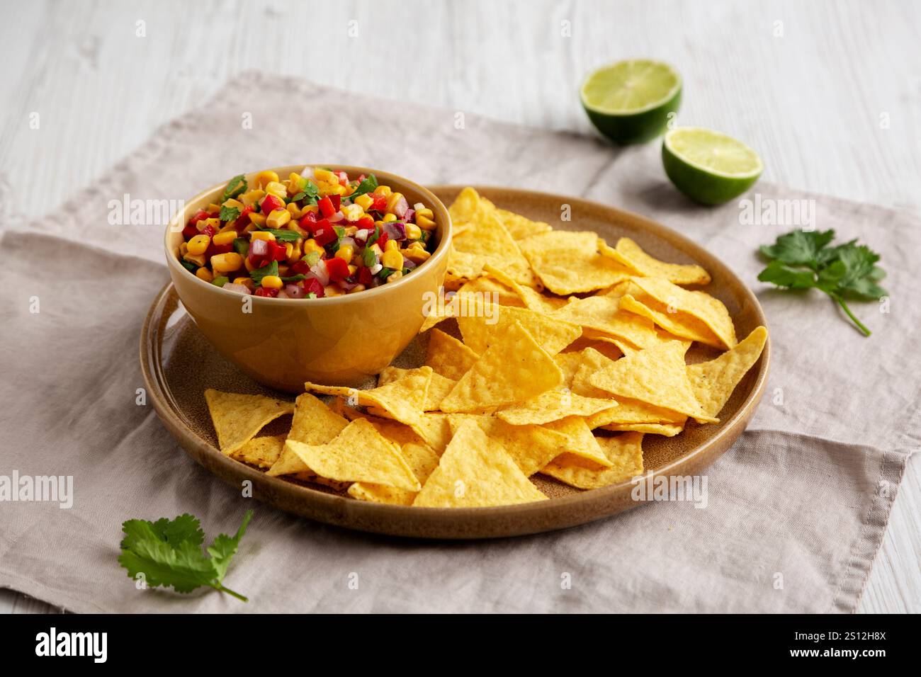 Homemade Corn Salsa with Tortilla Chips on a Plate, side view Stock ...