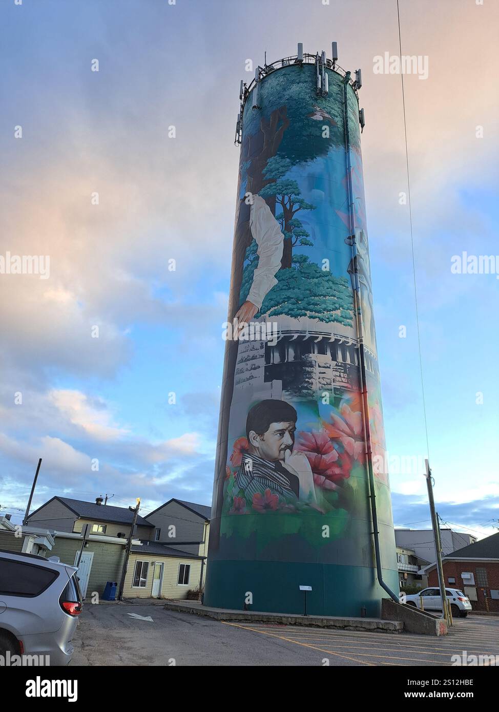 Le Gardien mural on a water tower in Dorion, Quebec, Canada Stock Photo ...