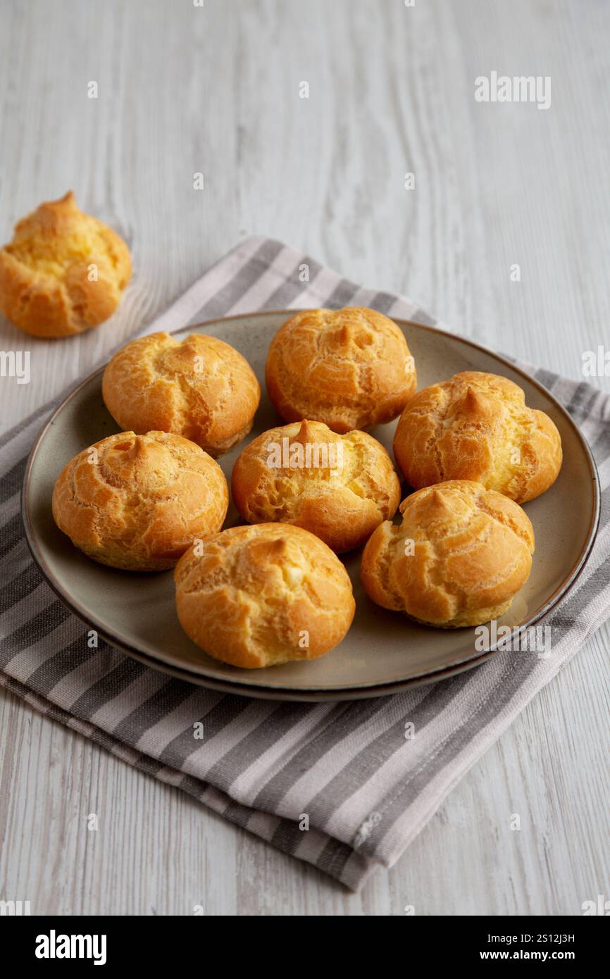Homemade French Mini Cream Puffs on a Plate, side view Stock Photo - Alamy
