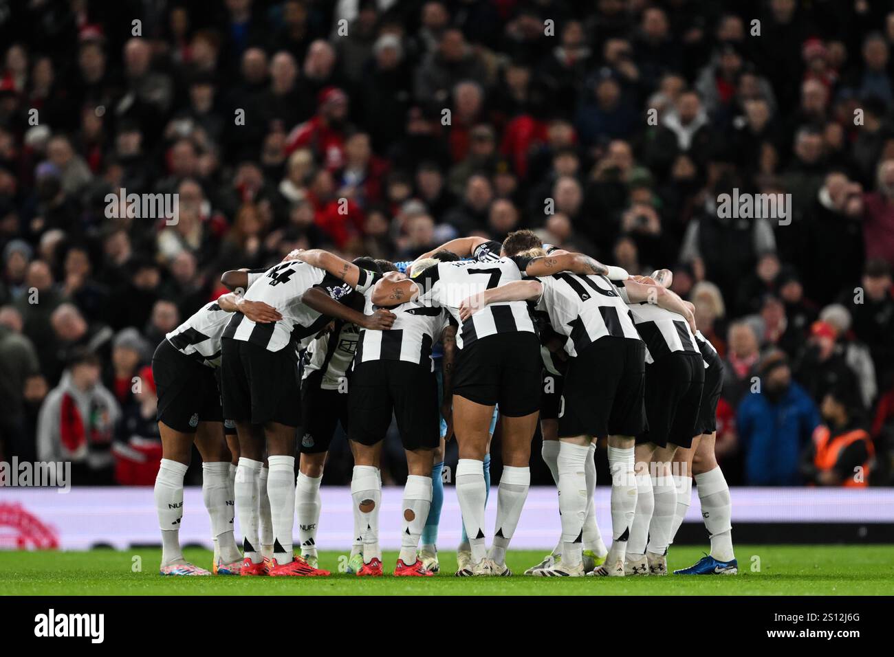 Newcastle United players form a huddle during the Premier League match ...
