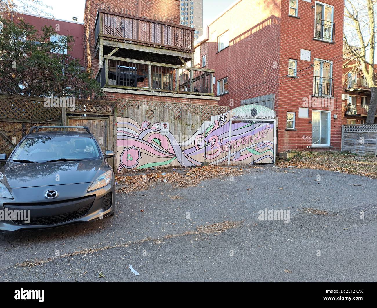 Welcome mural on a wooden fence in downtown Montreal, Quebec, Canada ...