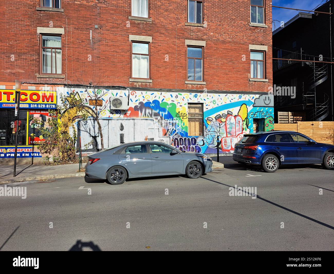 Golden crown mural covered with graffiti in Hochelaga neighborhood in ...