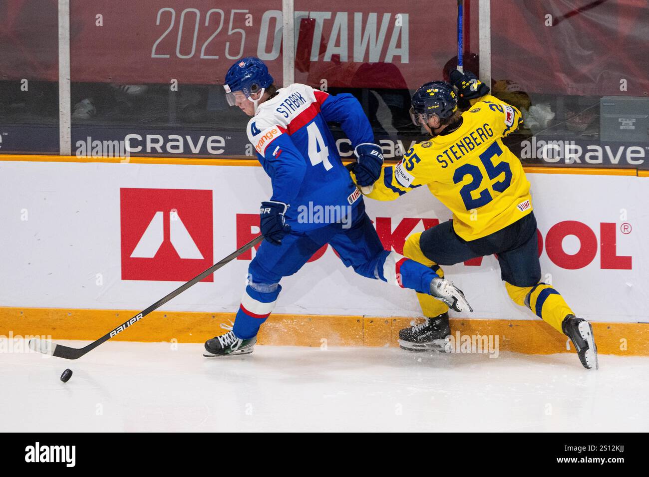 Ottawa, Canada. 26th Dec, 2024. Slovakia's Maxim Strbak (4) and Sweden ...