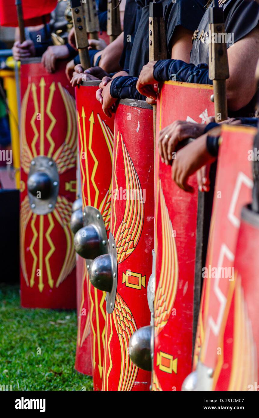 Men equipped as a Roman legionary formed in a row at a historical ...