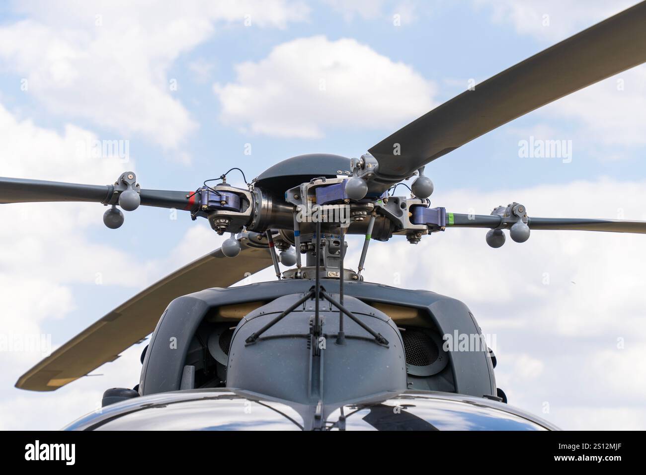 Gray painted modern H145M military transport helicopter main rotor ...