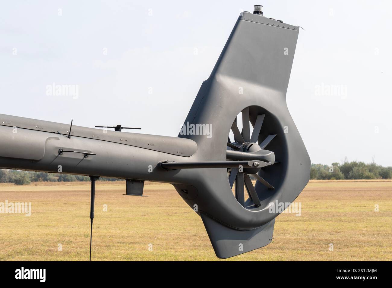 Gray painted modern H145M military transport helicopter tail rotor ...