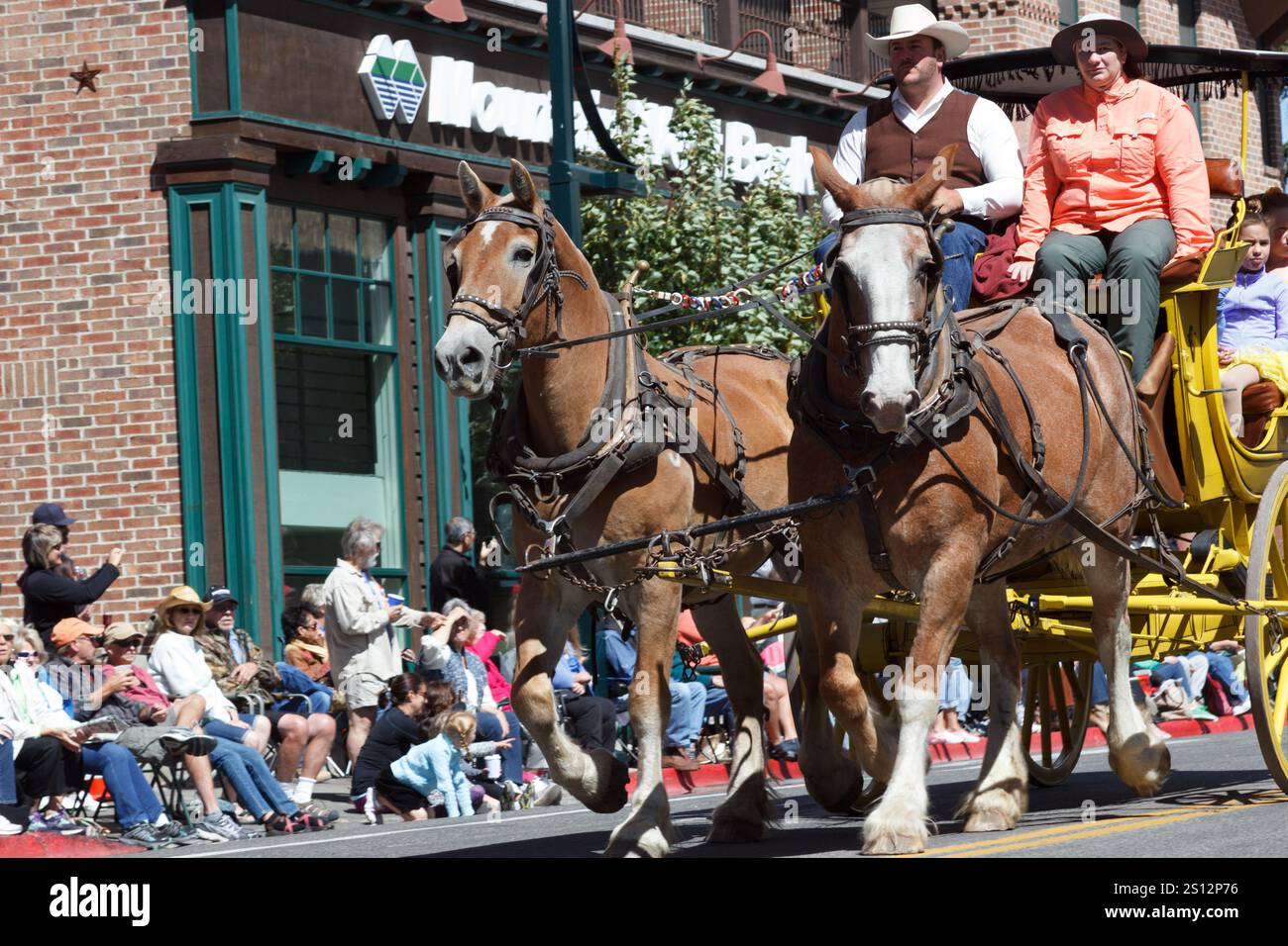 Horse-Drawn Carriage in Colorful Parade with Spectators on City Street ...
