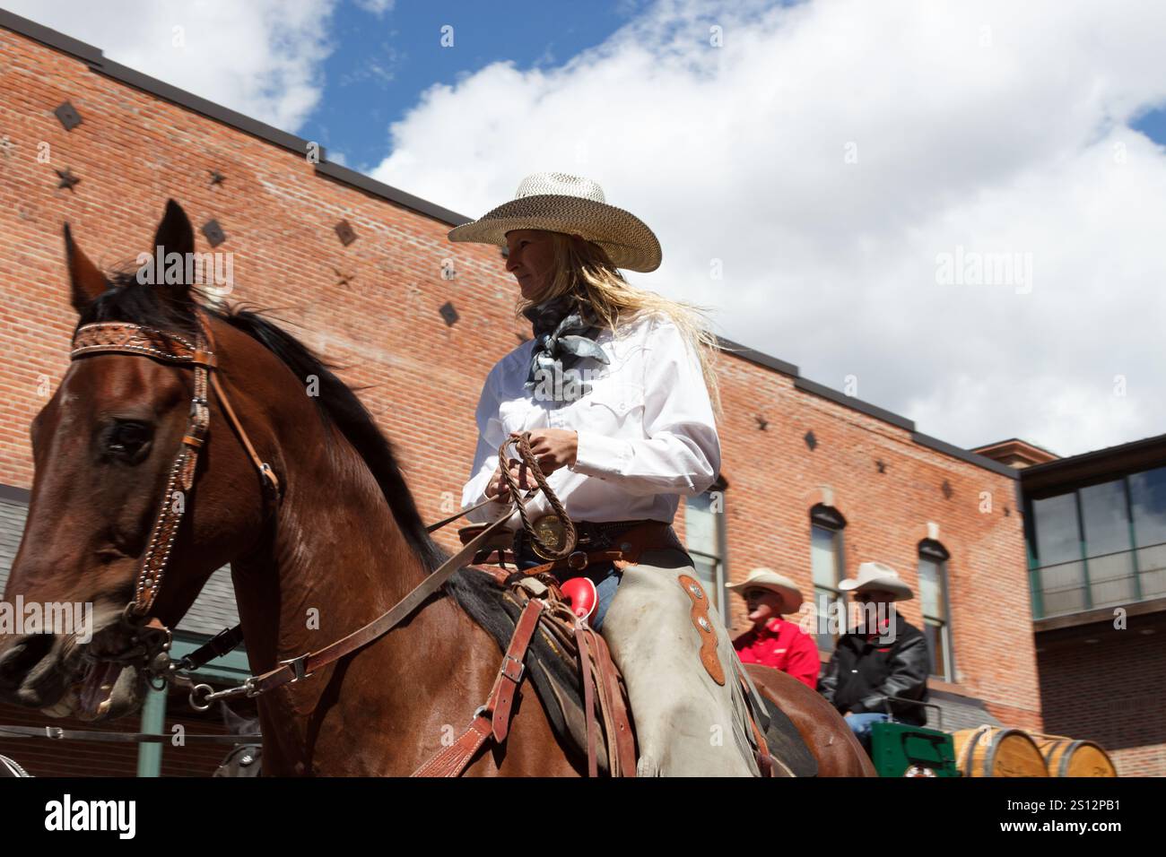 Rodeo Parade Rider on Horseback in Traditional Western Attire, Wagon ...