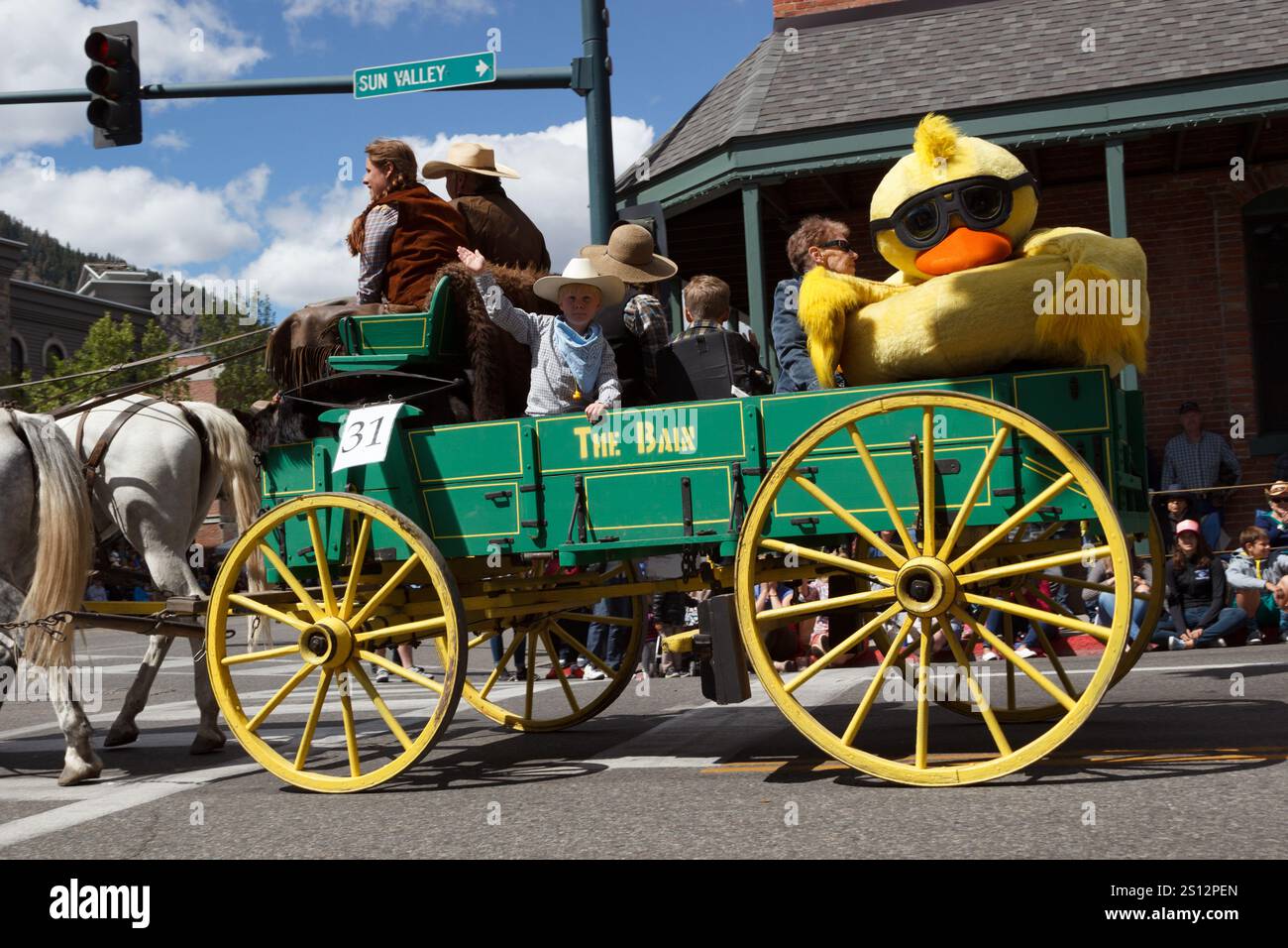 Horse-Drawn Carriage in Colorful Parade with Spectators on City Street ...