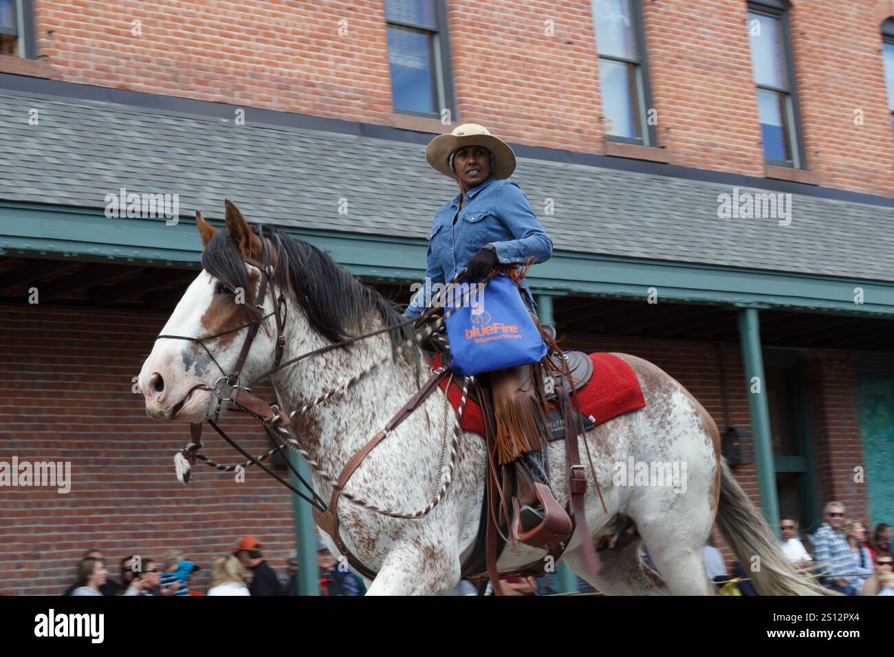 Rodeo Parade Rider on Horseback in Traditional Western Attire, Wagon ...