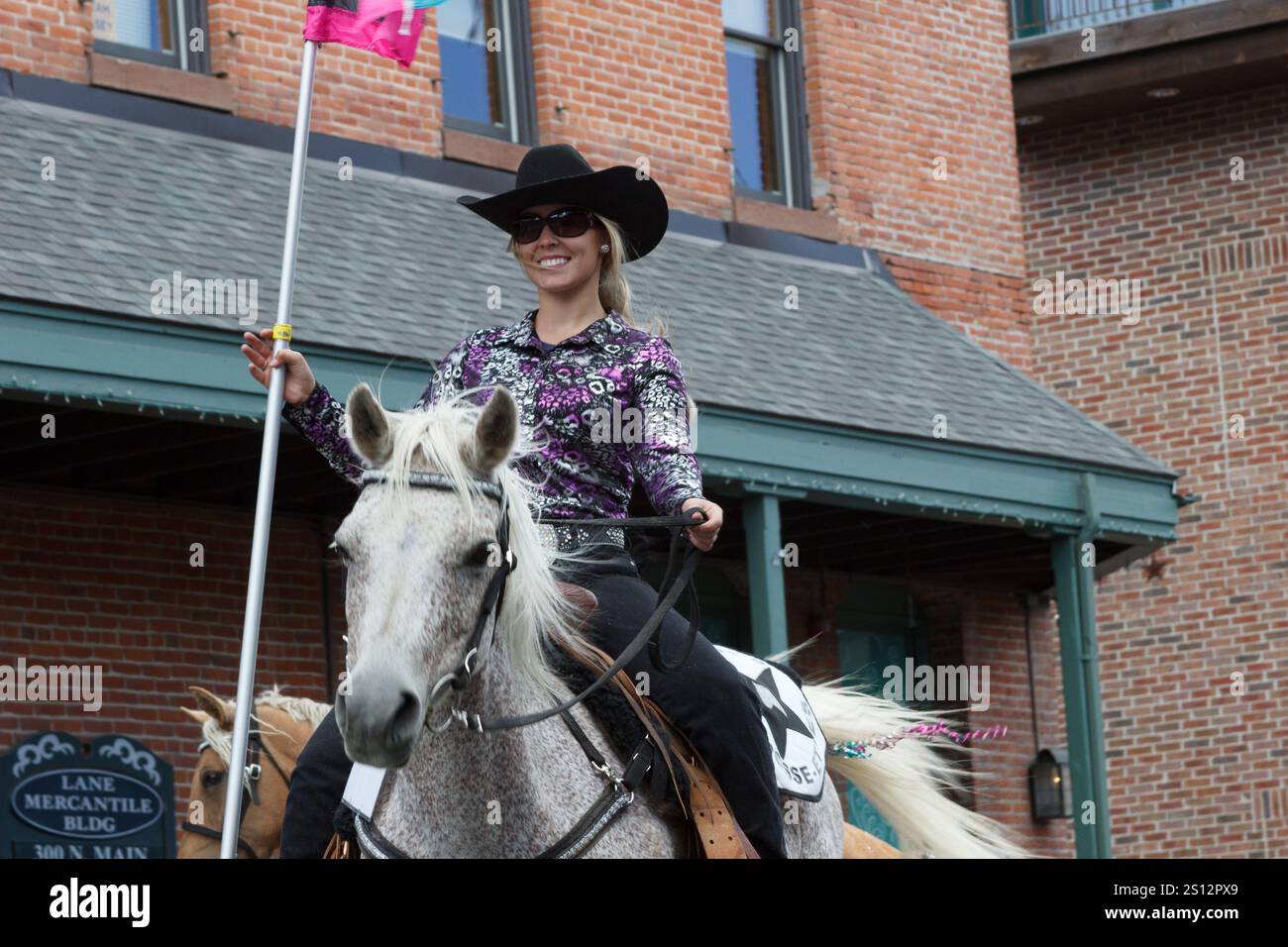 Rodeo Parade Rider on Horseback in Traditional Western Attire, Wagon ...