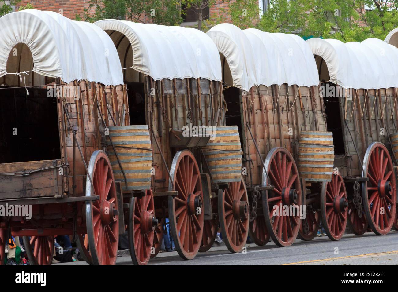 Old Covered Wagons in a Row Displayed on a Historic Street, Wagon Days ...