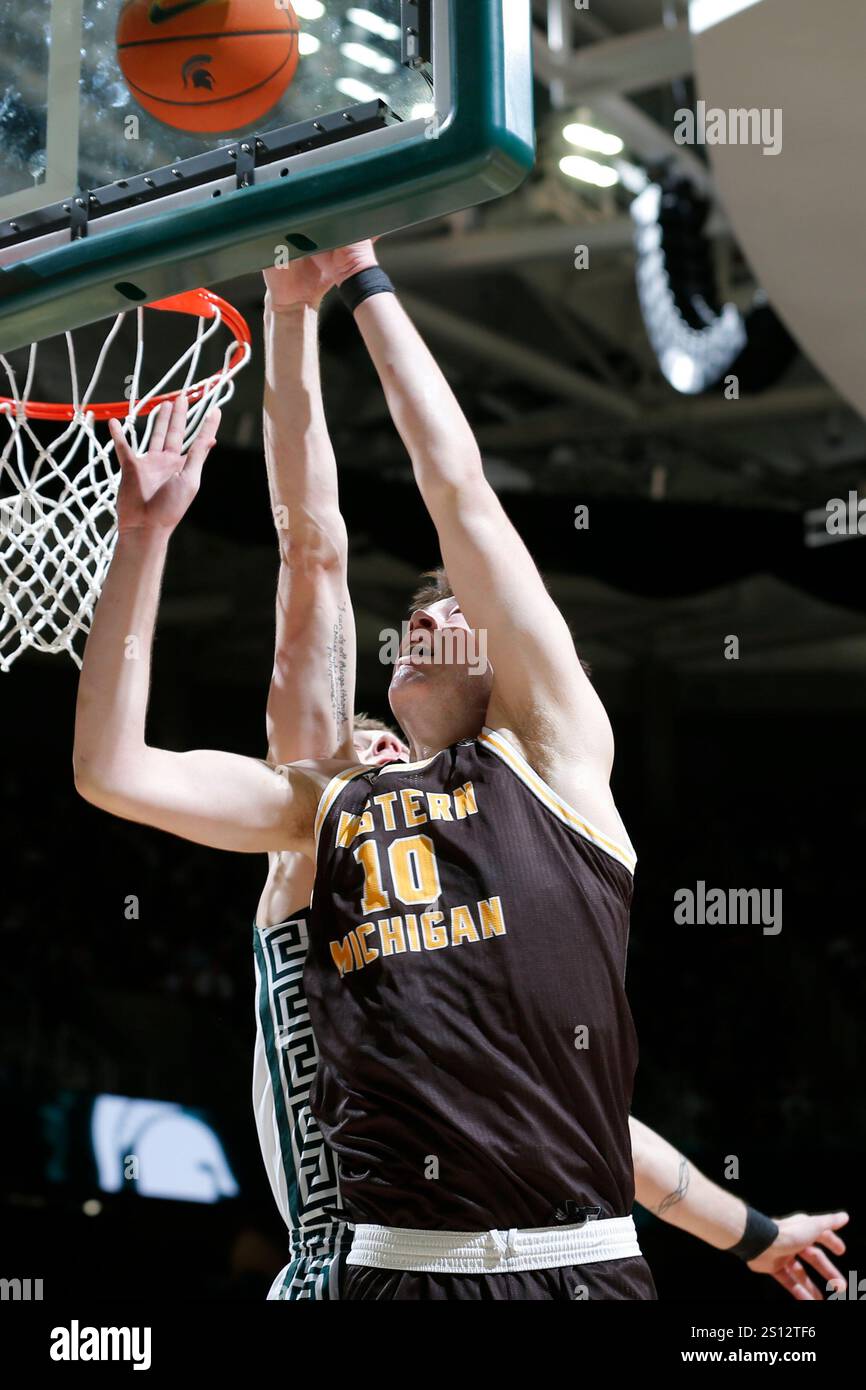 Western Michigan forward Max Burton, right, shoots against Michigan ...